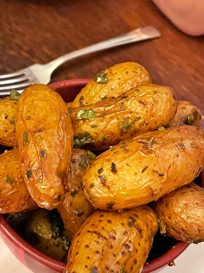 Fingerling potatoes that look like they've been to a spa day. Glistening with herbs and perfectly roasted, they're the side dish that steals the spotlight.
