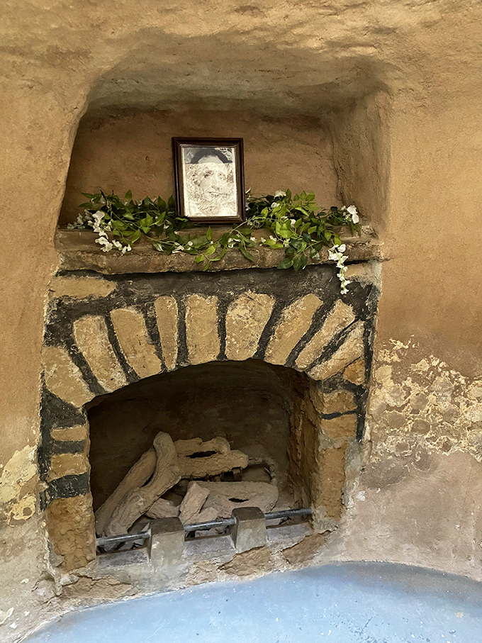 A cozy fireplace carved from hardpan soil. When your entire home is underground, even your hearth becomes a work of art.