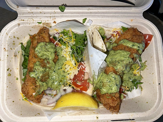 Fish tacos topped with enough fresh avocado to remind you this is California, where we put it on everything.