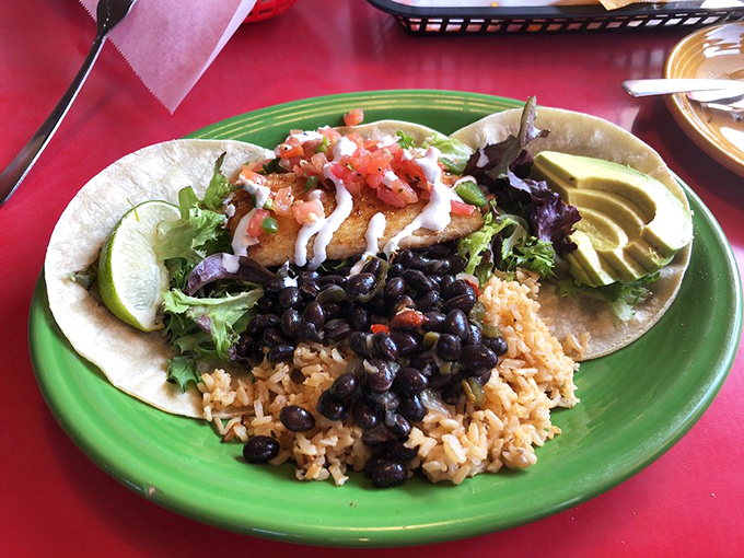 Fish tacos that bring coastal vacation vibes inland. That perfect bite of crispy fish, creamy sauce, and fresh vegetables is a mini-vacation on a plate.