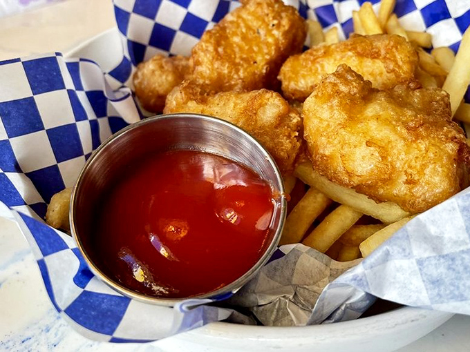 Fish and chips that would make a British pub-goer weep with joy. That golden batter is performing a perfect crunch symphony.