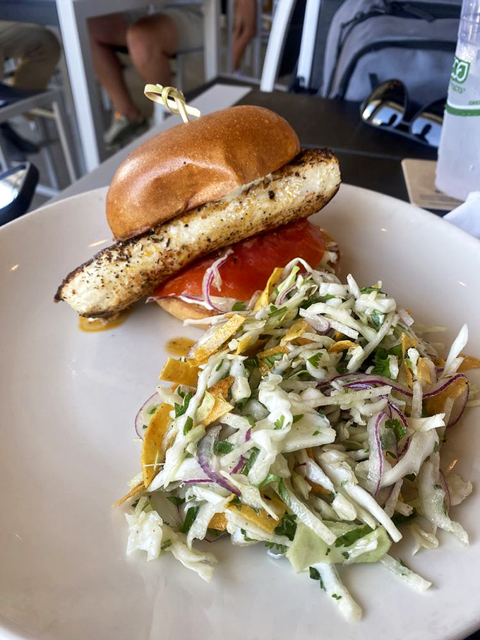 This fish sandwich isn't messing around. Perfectly grilled, nestled in a pillowy bun, with that coastal slaw adding just the right crunch.