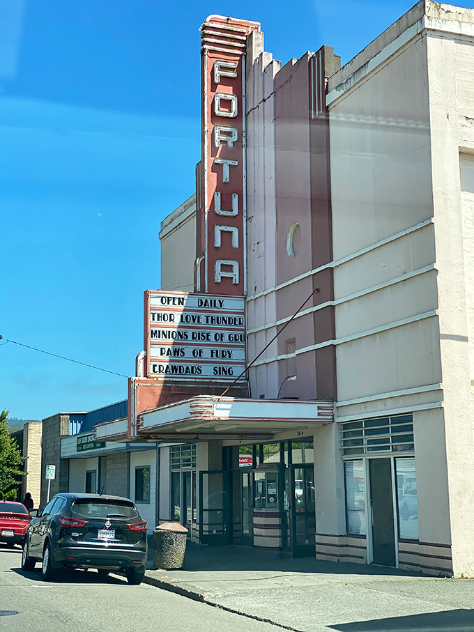 The historic Fortuna Theatre marquee advertises entertainment the old-fashioned way, when movies didn't need Roman numerals after their titles.
