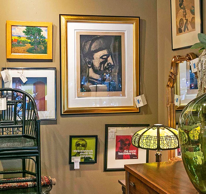 The art wall creates a salon-style gallery where portraits of strangers might become the most interesting guests at your next dinner party.