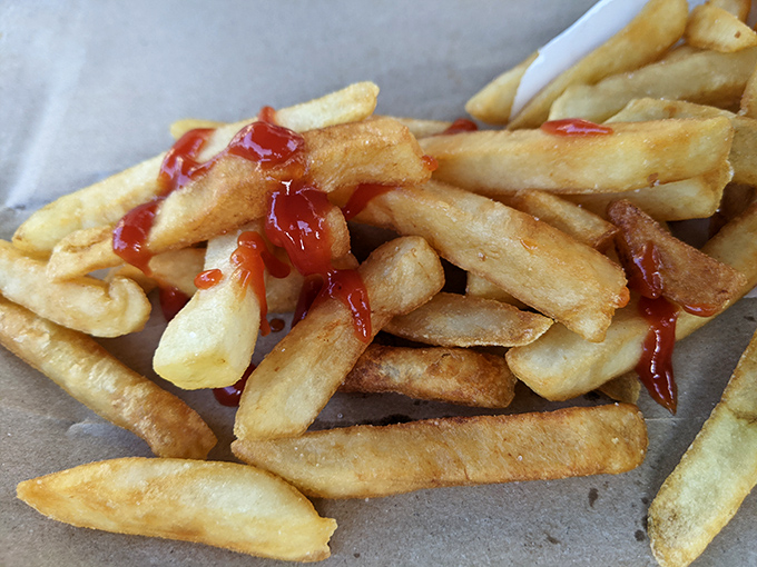 Sometimes the simplest pleasures are the best. These golden fries with a splash of ketchup are the supporting act that sometimes steals the show.