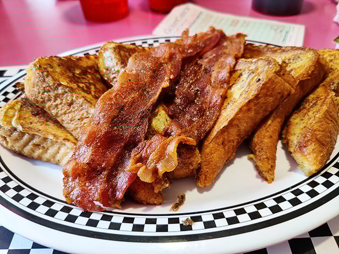 French toast and bacon: the breakfast power couple that's outlasted every Hollywood romance. Crispy meets custardy in perfect harmony.