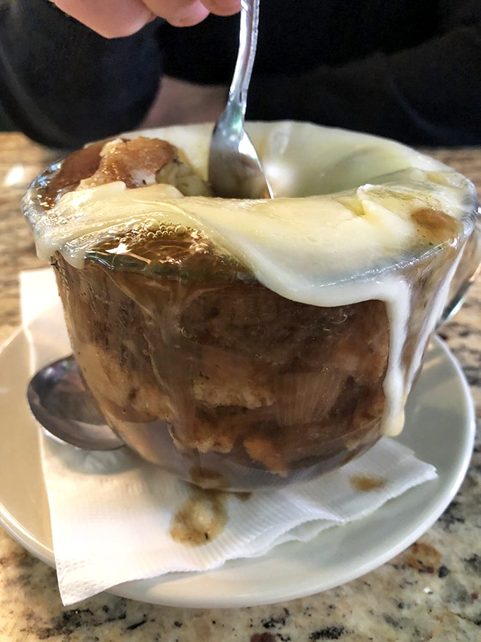 French onion soup so good it should have its own passport, with cheese stretching to infinity and beyond with each magnificent spoonful.