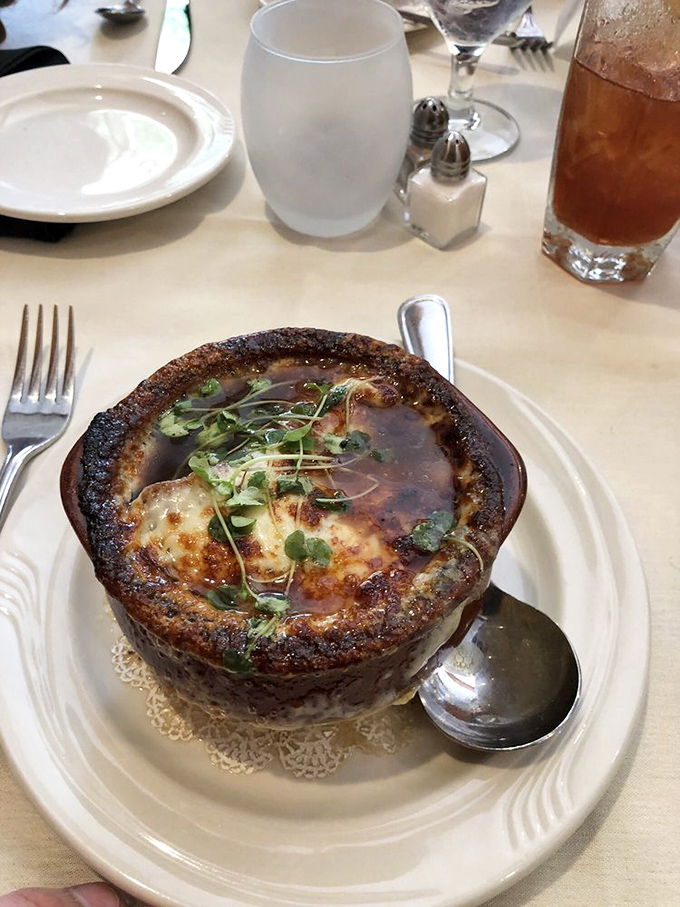 French onion soup that's worth the inevitable cheese pull photo-op, with a crown of golden, bubbling goodness that's practically begging to be broken.