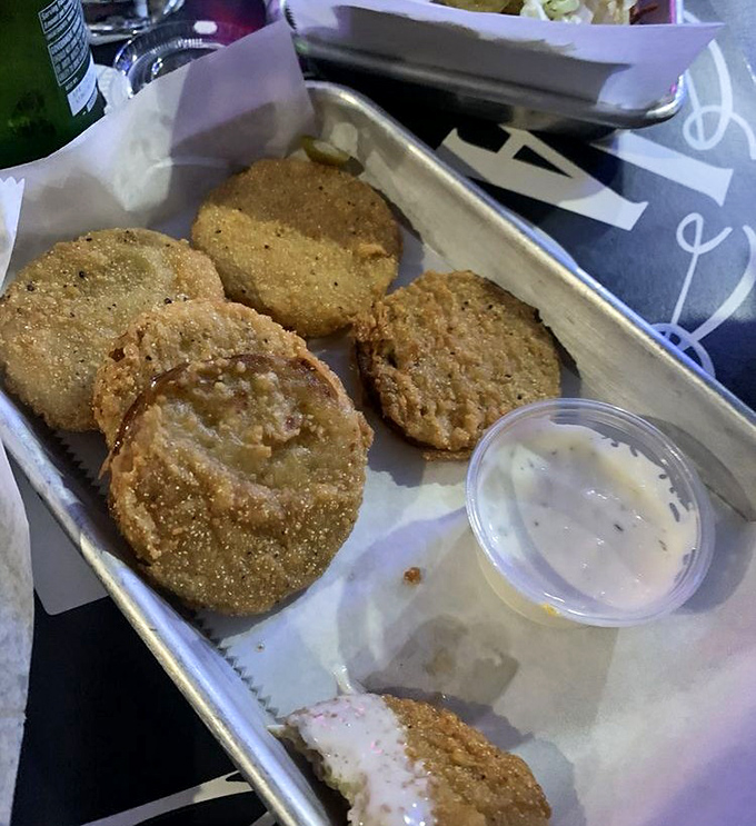 Fried green tomatoes: the South's gift to the culinary world. Crispy, tangy, and perfect for people who think they don't like tomato.
