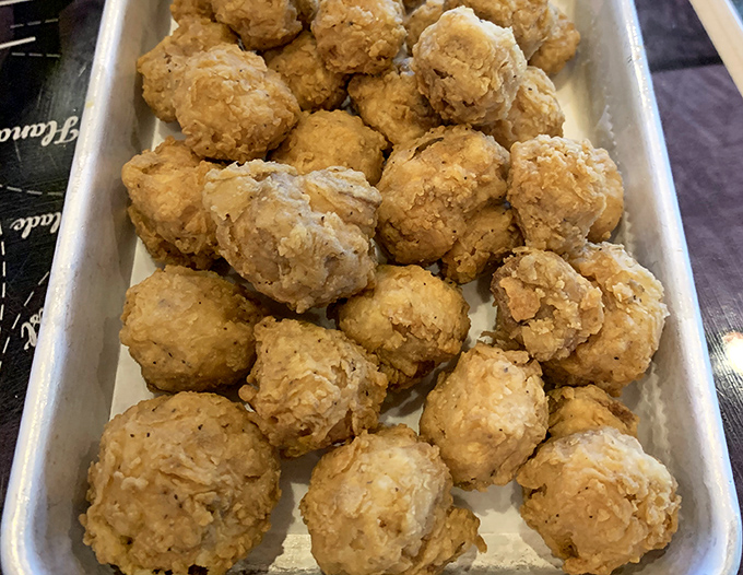 Hushpuppies that don't hush about how good they are. These golden orbs of cornmeal joy are worth every delicious calorie.