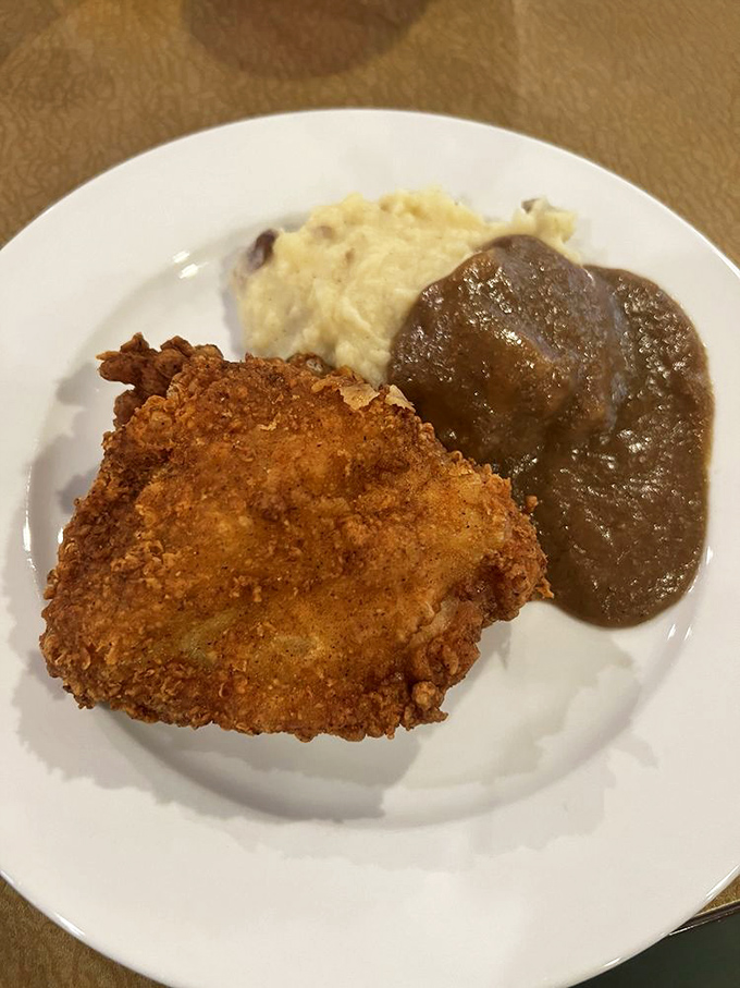 Fried chicken with the kind of golden crust that makes you want to write poetry. The mashed potatoes and gravy are just the backup singers.