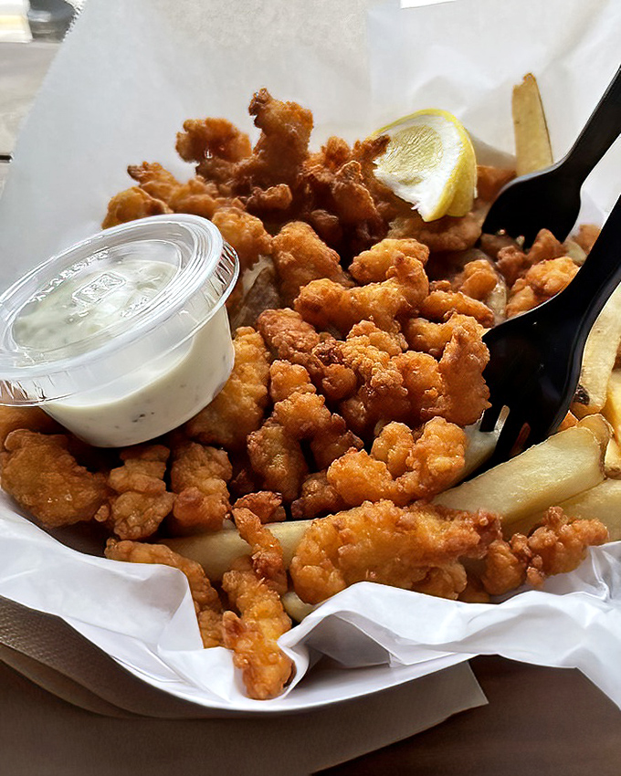 These fried clams aren't just golden brown, they're little nuggets of oceanic perfection that would make a New Englander weep with joy.