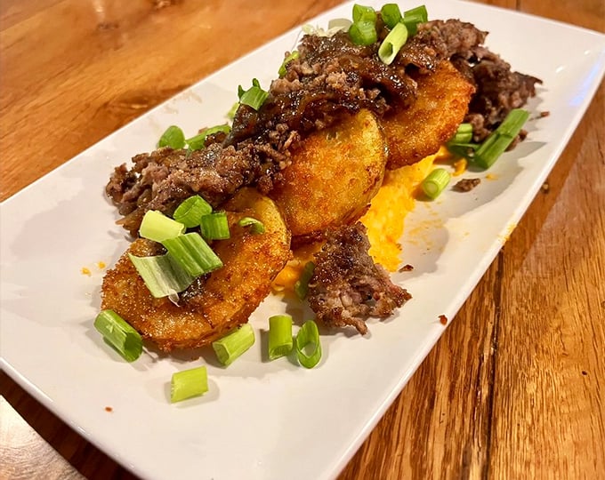 Fried green tomatoes topped with mysterious deliciousness &ndash; sometimes the best discoveries come from adventurous menu choices.