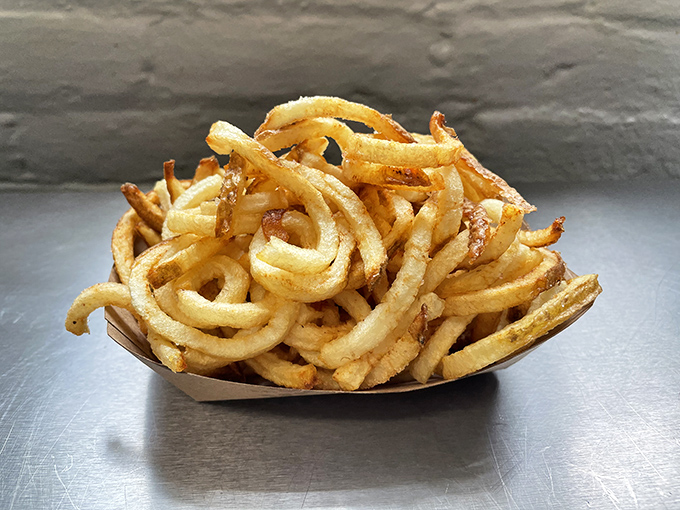 These aren't just fries; they're golden spirals of crispy joy that complete any sandwich experience.