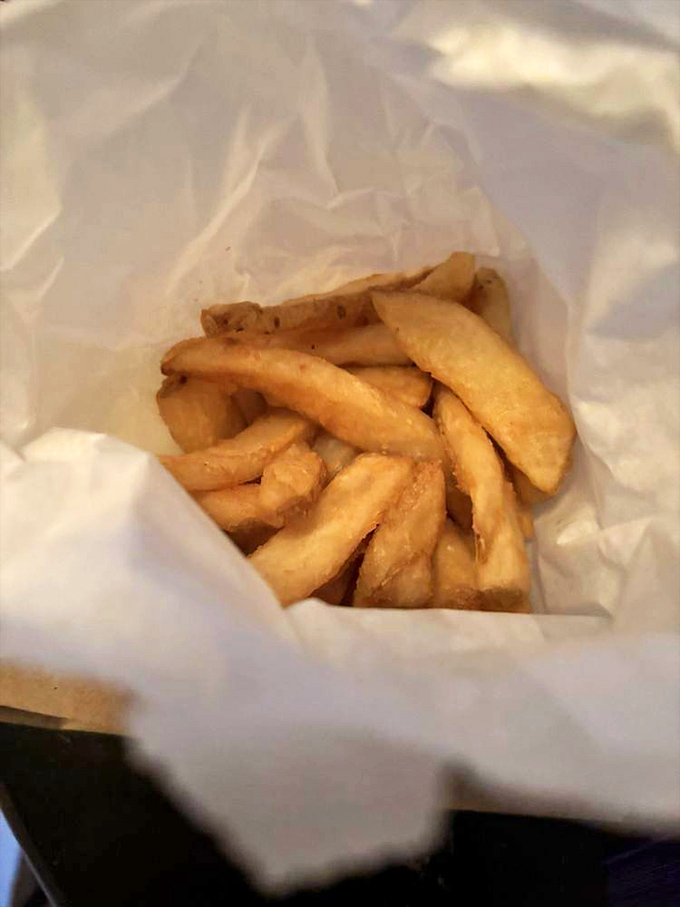 These aren't just fries&mdash;they're golden potato wands of happiness, nestled in paper like the simple treasure they are.