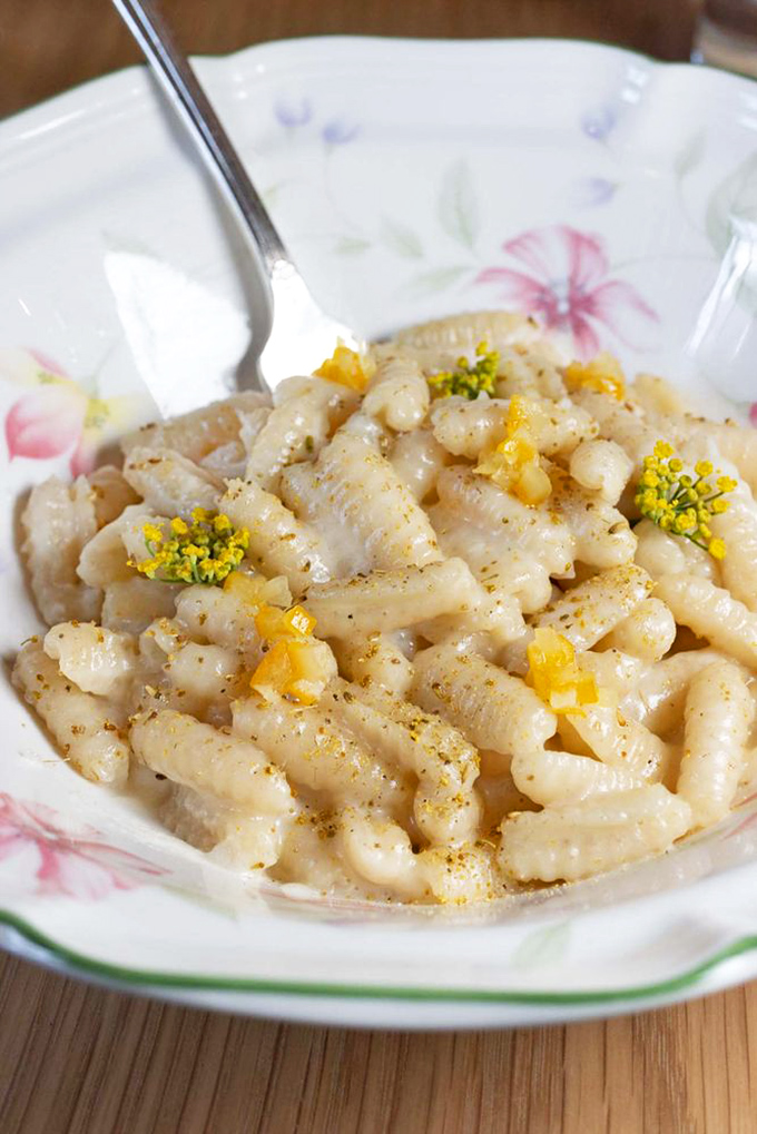 Handmade gnocchi that looks like little pillows of joy, dusted with herbs and ready for their close-up.