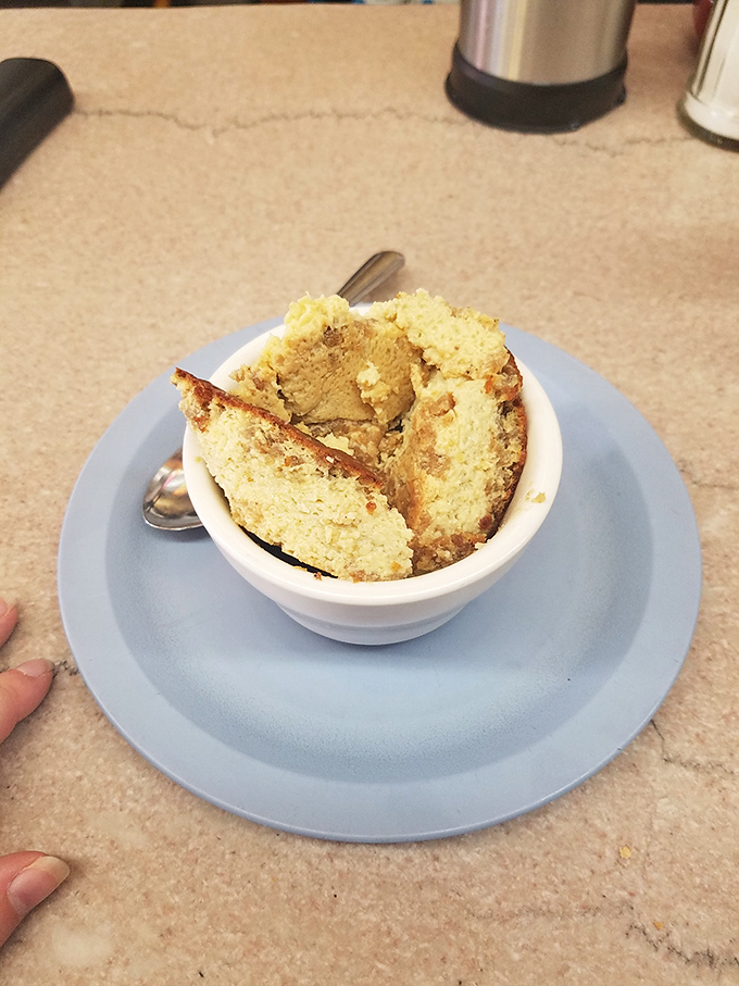 Grapenut pudding &ndash; a New England classic that bewilders outsiders but comforts locals, sweet nostalgia served in a simple white bowl.