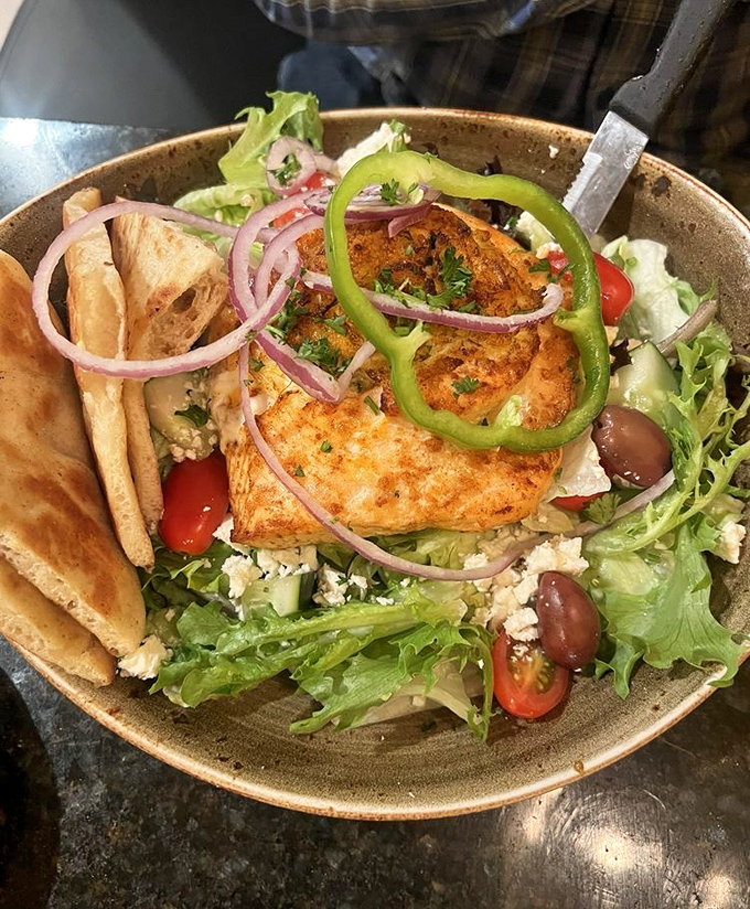 A Greek salad crowned with salmon that would make Poseidon himself swim upstream. Fresh, vibrant, and unapologetically Mediterranean.