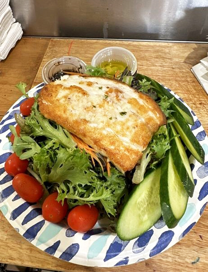 Even salads get the star treatment here&mdash;this halibut fillet perched atop fresh greens is proof that "eating light" doesn't mean sacrificing flavor or satisfaction.