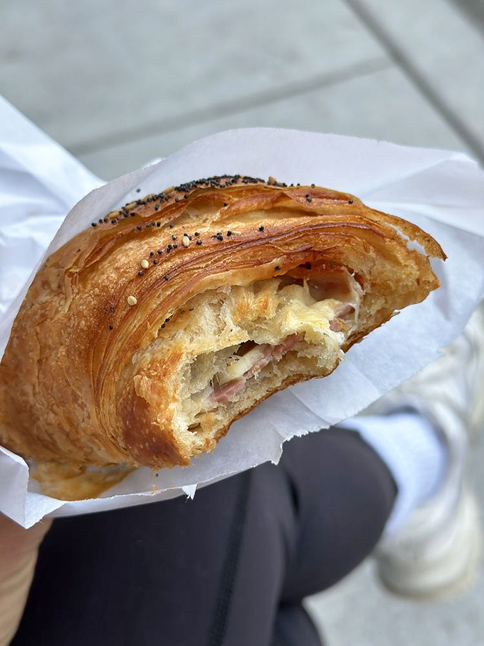 The ham and cheese croissant&mdash;where buttery layers meet savory fillings in a handheld masterpiece of breakfast perfection.