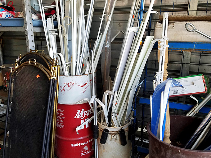 A forest of PVC pipes stands ready for DIY warriors. One person's plumbing supplies are another's craft project materials.