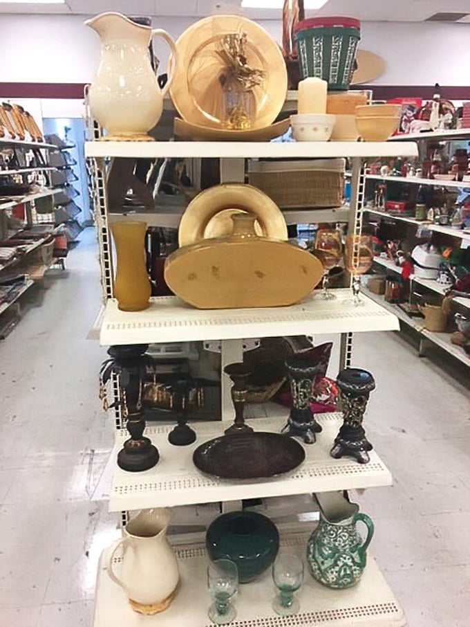 Ceramic treasures and vintage glassware stand at attention. Those blue margarita glasses are practically begging to host your next Taco Tuesday.
