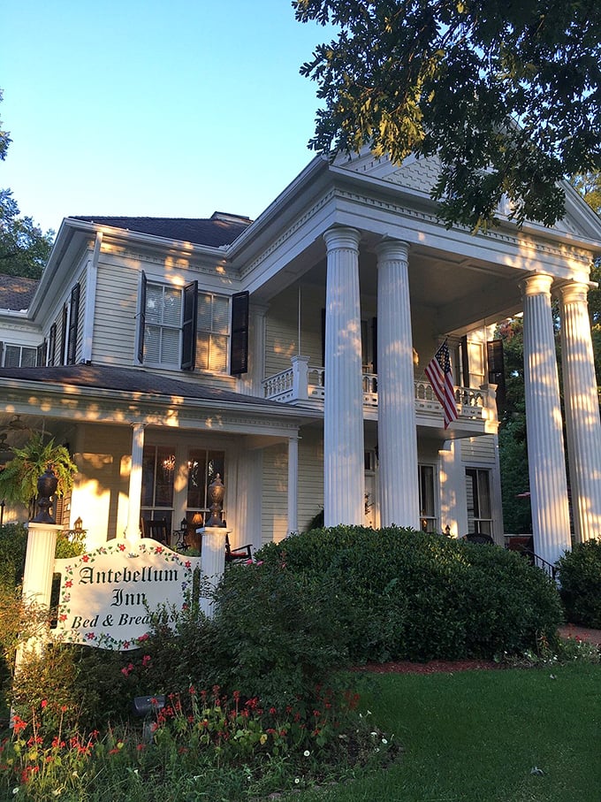 The Antebellum Inn captures twilight's golden glow like it was designed specifically for that magic hour when day surrenders to evening.