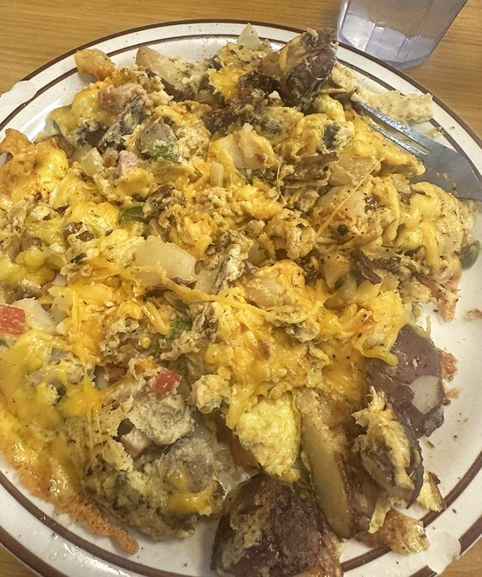 The Hungry Hollow Scramble doesn't just mix ingredients &ndash; it creates a beautiful chaos of flavors where eggs, cheese and meat find their perfect harmony.