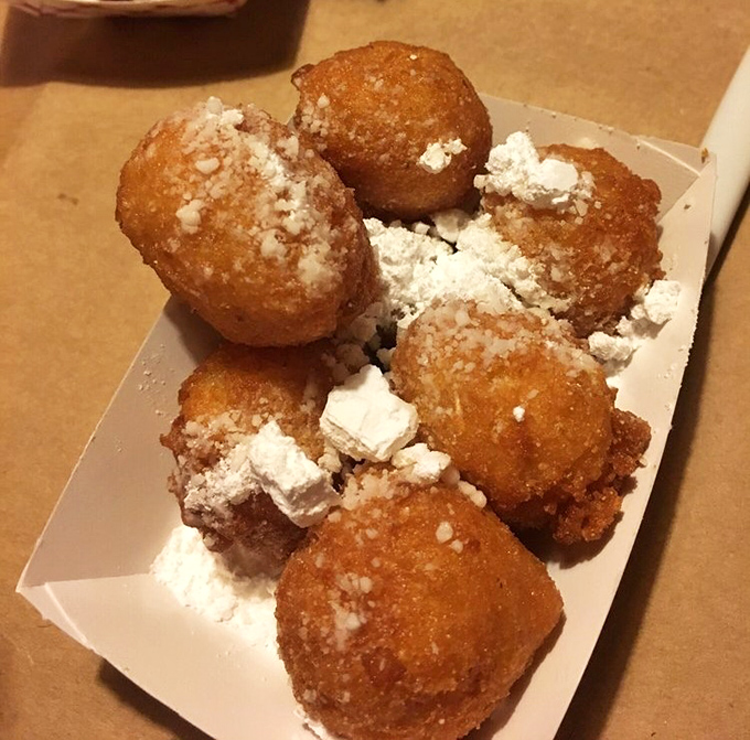 Hush puppies dusted with powdered sugar&mdash;a sweet-savory contradiction that somehow makes perfect sense after your first bite.