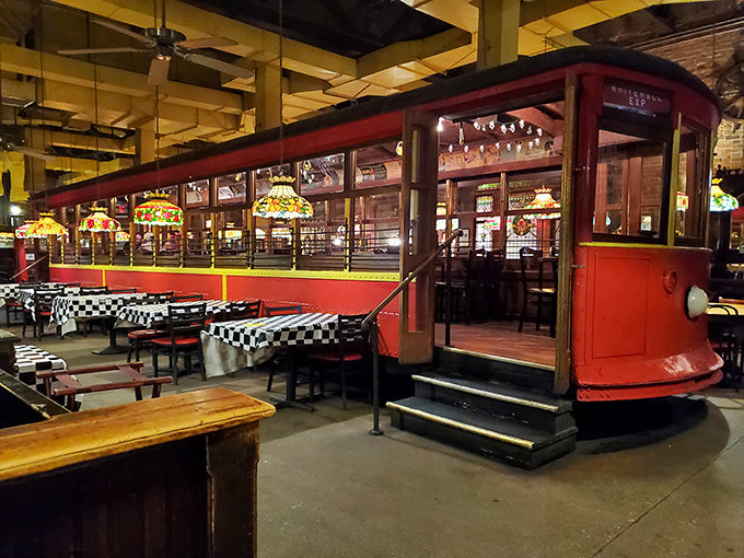 The trolley car at night transforms into a glowing time capsule of dining nostalgia. Those Tiffany-style lamps aren't just lighting the space&mdash;they're setting the mood.