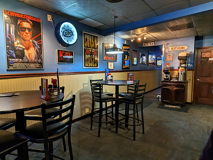 Movie posters and memorabilia create a pop culture playground for grown-ups. The Terminator seems to approve of your burger choice.