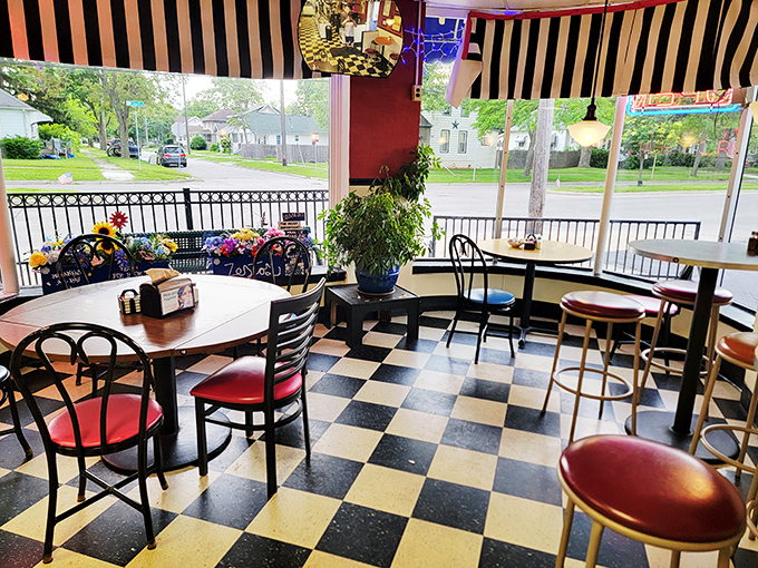 The window seats at Fuzzy's offer prime people-watching real estate while the checkered floor reminds you that life, like chess, is best played with good food nearby.