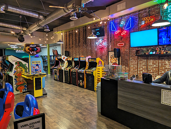 A rainbow of electronic entertainment lines the walls, each cabinet a portal to when "wireless" meant you tripped over fewer cords.