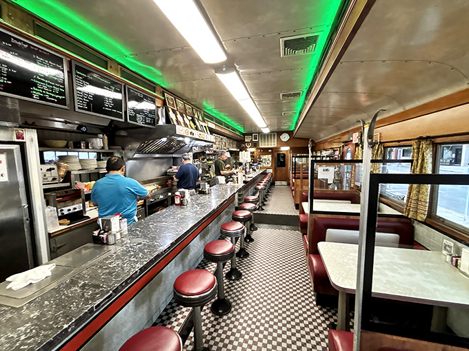 The long, narrow layout of a classic railroad car diner, where every seat feels like you've scored the best table in the house.