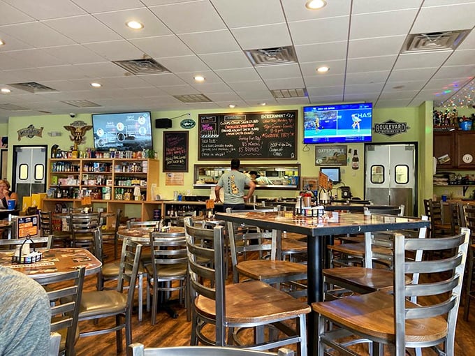 The dining room balances sports bar energy with family restaurant comfort&mdash;note the dartboard waiting for your post-sandwich competition.