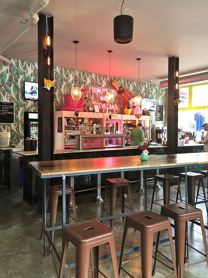 Pink cabinets, tropical wallpaper, and a neon sign declaring "DONUT MESS WITH CLEVELAND"&mdash;this counter area is what Instagram dreams are made of.