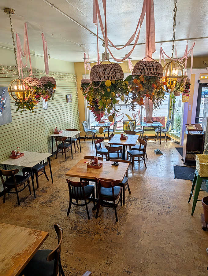 Wicker basket chandeliers draped with flowers create a whimsical canopy over diners&mdash;like breakfast under a botanical big top.