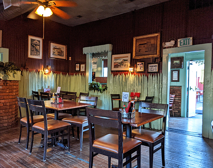 The mint-green wainscoting and wood-paneled walls aren't trendy design choices&mdash;they're authentic touches from an era when restaurants lasted generations.