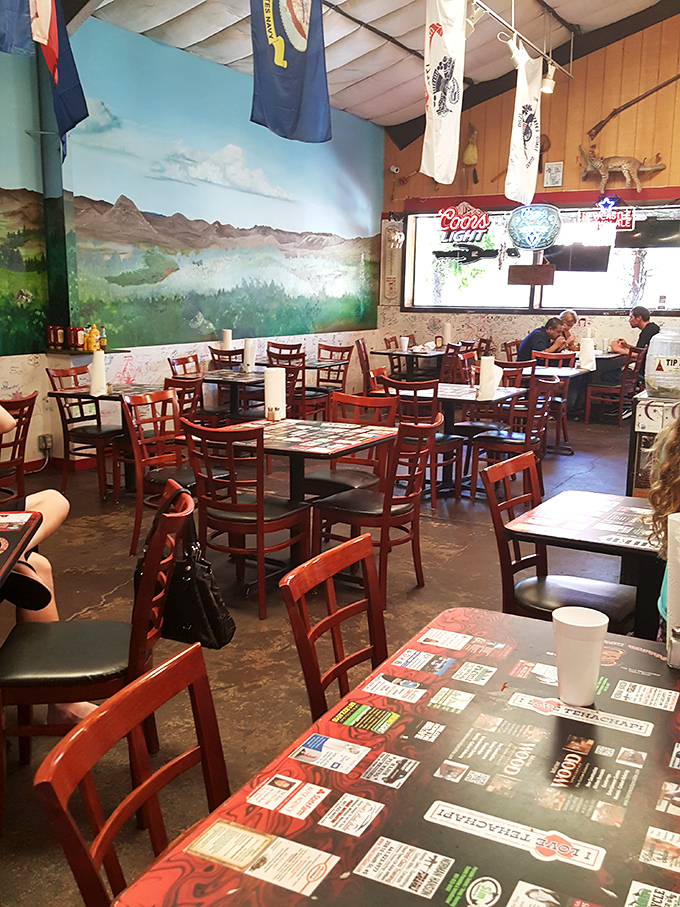 The dining room buzzes with conversation and anticipation, while that spectacular mural reminds you you're dining in California's mountain country.