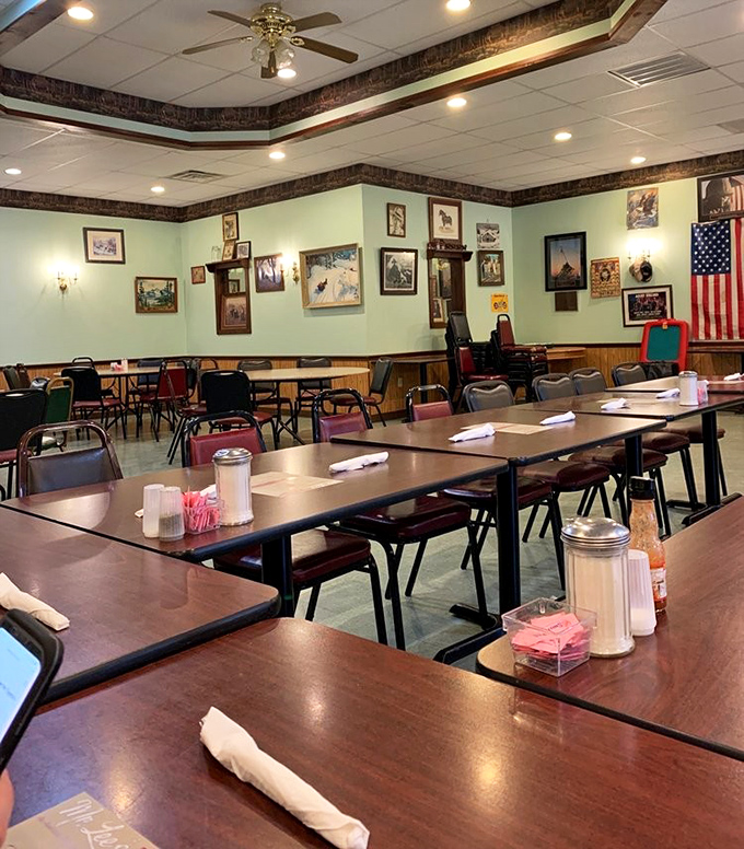 The mint-green walls adorned with framed memories create a dining room that feels more like visiting family than a restaurant.