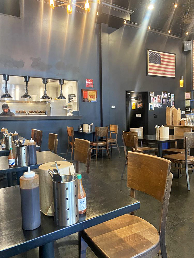 American flag on the wall, sauce bottles on the tables, and anticipation in the air. This dining room knows exactly what it's about.