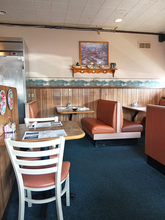 Wood paneling, landscape art, and booths designed for lingering conversations&mdash;this corner of the dining room has witnessed countless family stories.