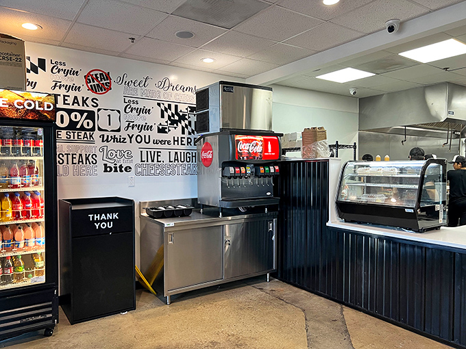 The wall art speaks the universal language of food lovers: "Live, Laugh, Bite"&mdash;three words that perfectly capture the Cheesesteak & Co. philosophy.