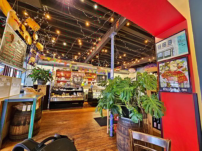 String lights, wooden barrels, and plants create the kind of warm atmosphere that makes you want to linger long after your sandwich is gone.