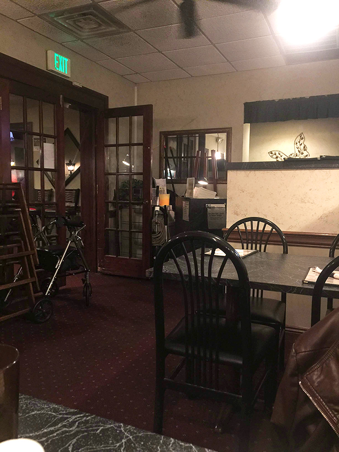 Warm lighting and granite tables create an inviting atmosphere where conversations flow as freely.