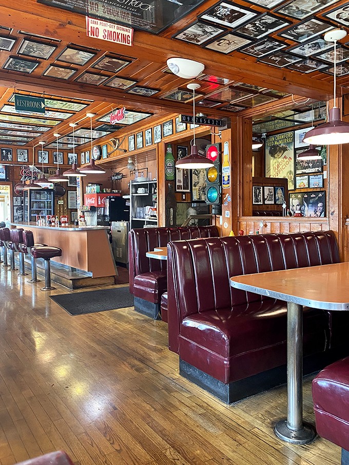 Classic diner booths in burgundy vinyl—where sliding in feels like coming home, even if you've never been here before.