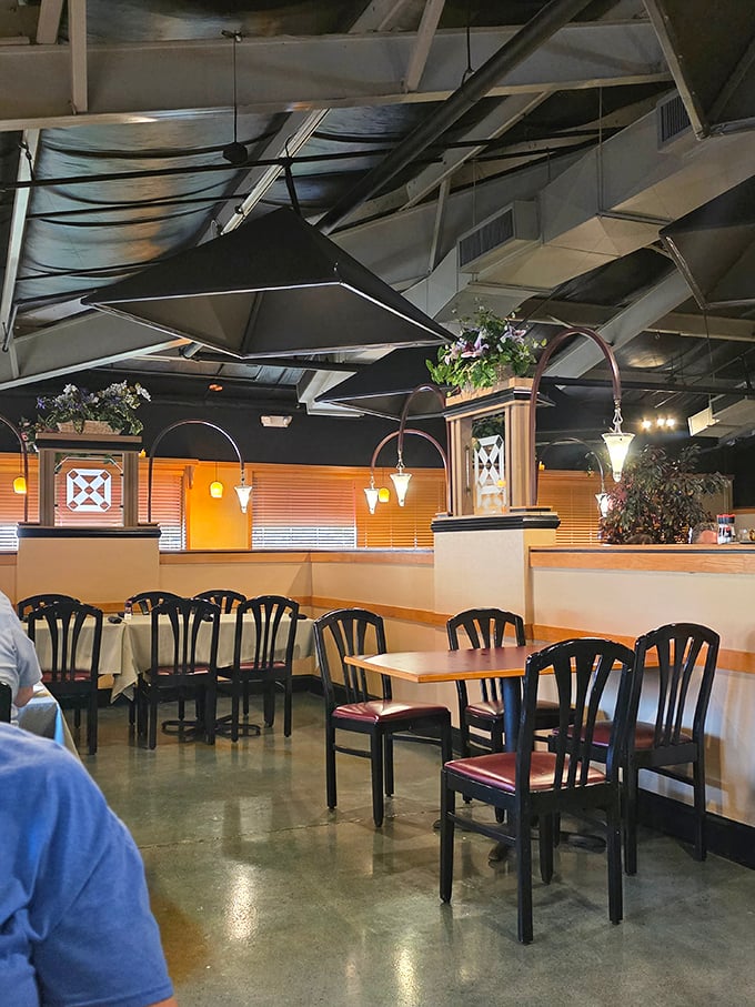 Another dining area where hanging plants and soft lighting create the perfect atmosphere for contemplating a second helping.