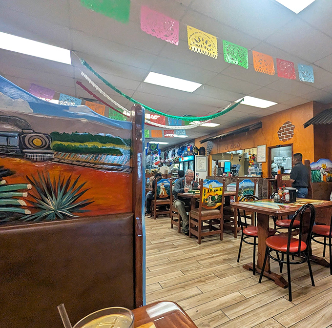 Colorful papel picado flags dance overhead while vibrant murals transport diners straight to Mexico. Who needs a passport when you have this ambiance?