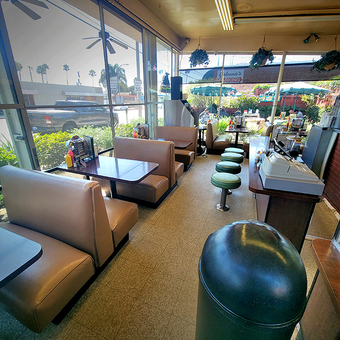 The dining room feels like stepping into a time machine&mdash;vinyl booths, hanging plants, and the promise of comfort food that never disappoints.