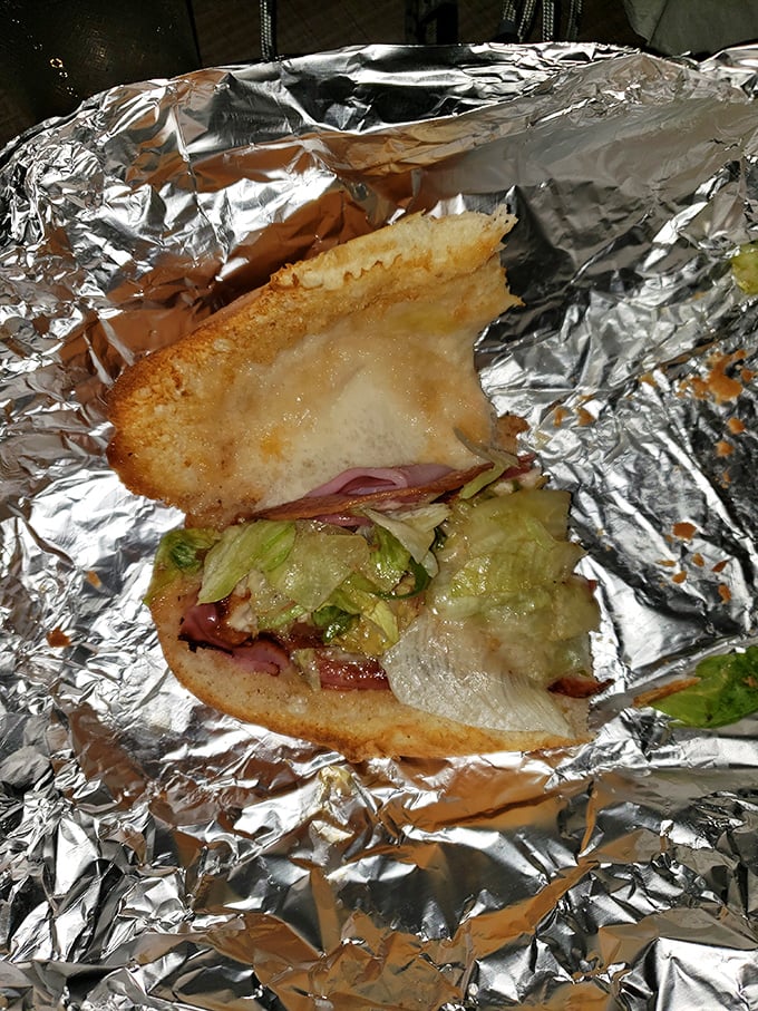 Half-eaten because nobody has the willpower to pause for a photo when faced with an Italian sub this good.